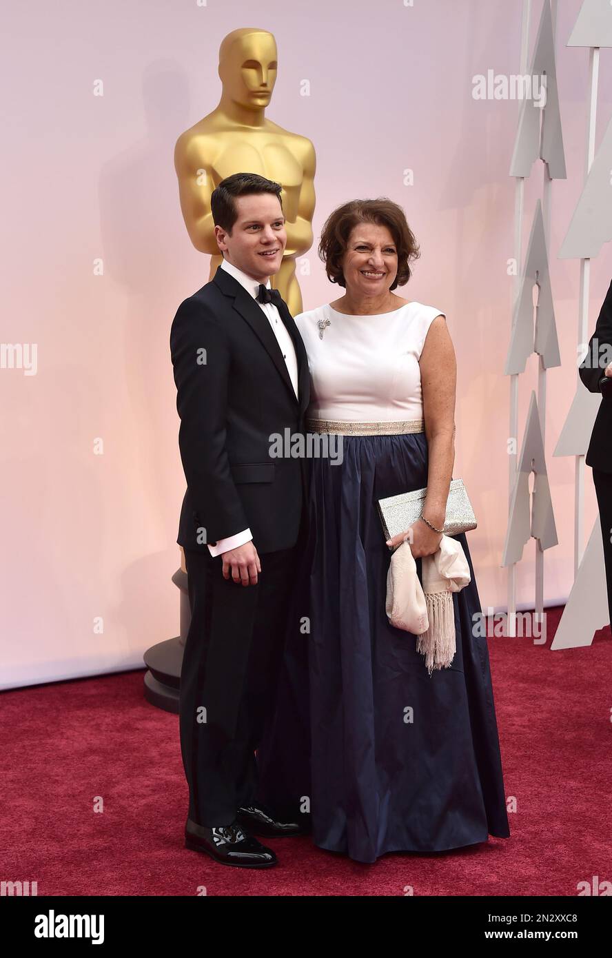 Graham Moore, left, and Susan Sher arrive at the Oscars on Sunday, Feb ...