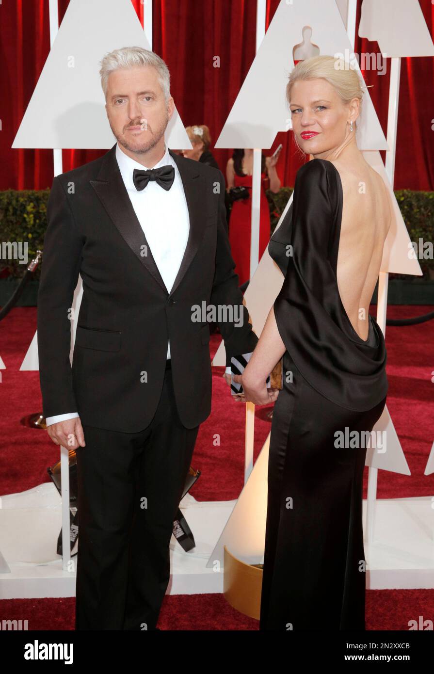 Anthony McCarten, left, and Eva Maywald arrive at the Oscars on Sunday ...
