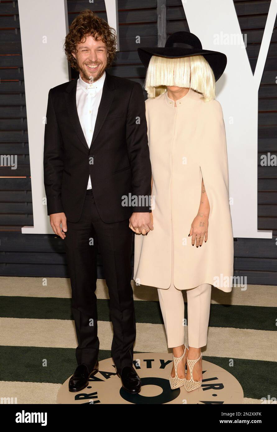 Erik Anders Lang, left, and Sia arrive at the 2015 Vanity Fair Oscar ...