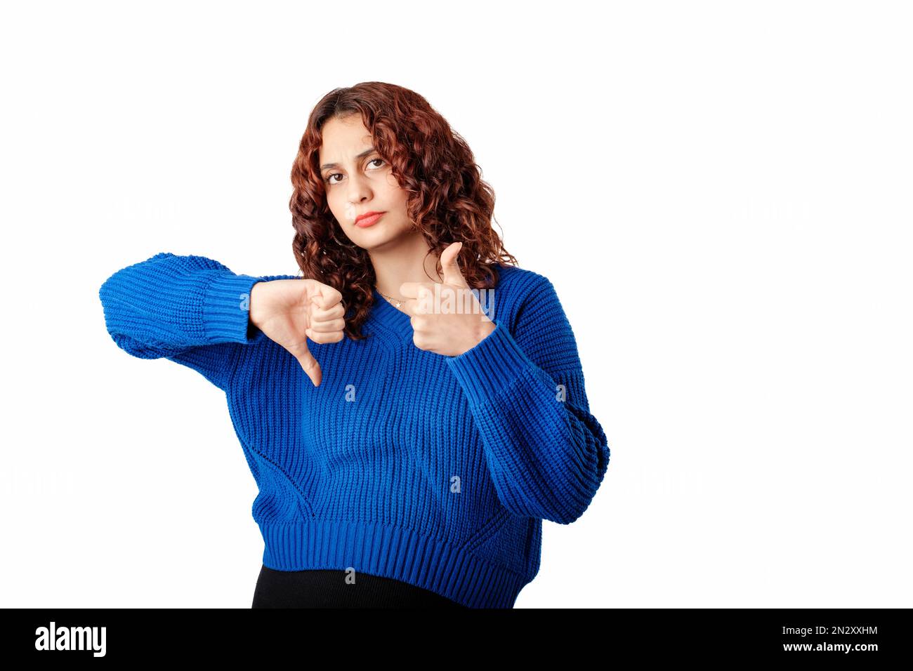 Portrait of cute woman wearing pullover sweater standing isolated over ...