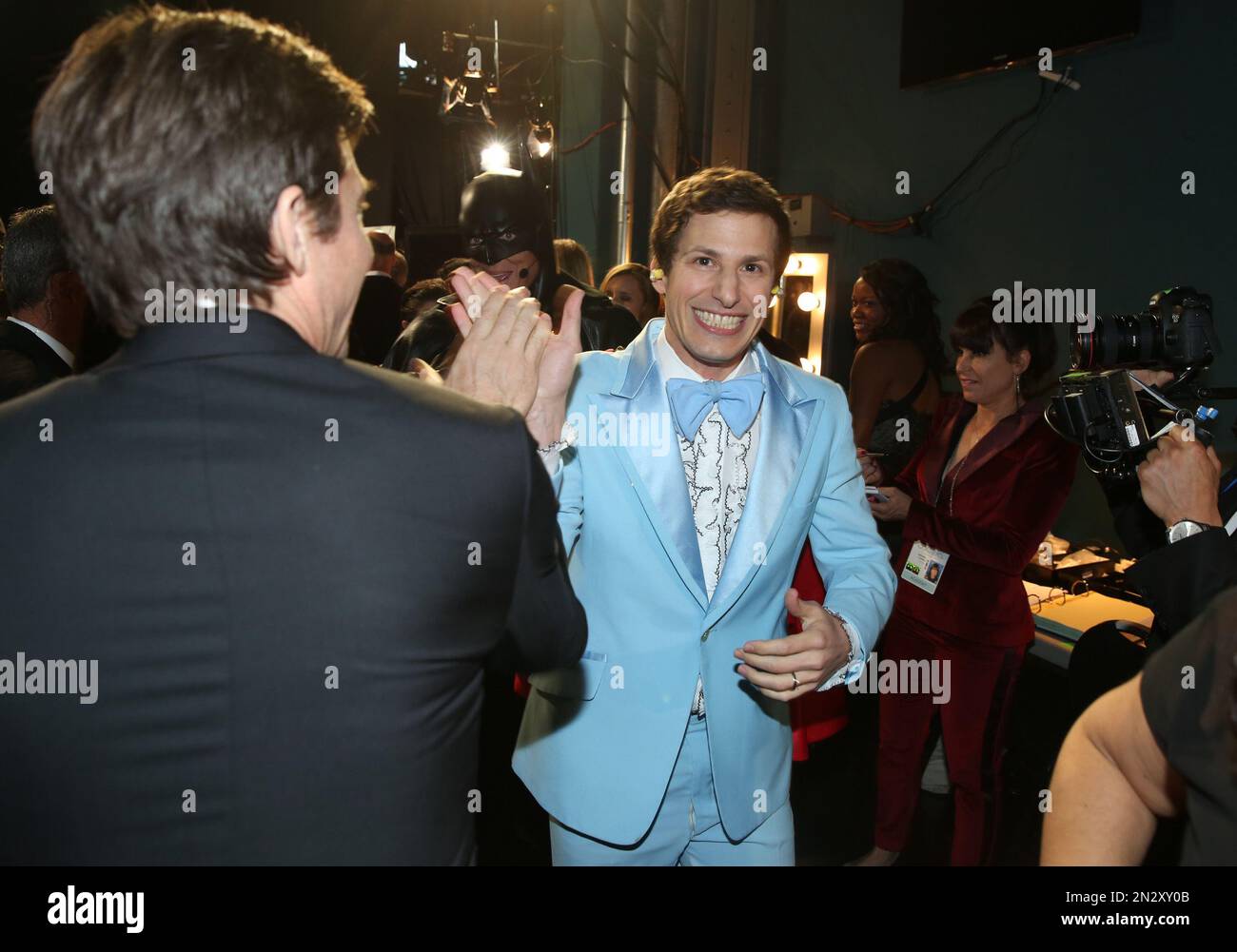 Jason Bateman, left, and Andy Samberg high five backstage at the Oscars ...