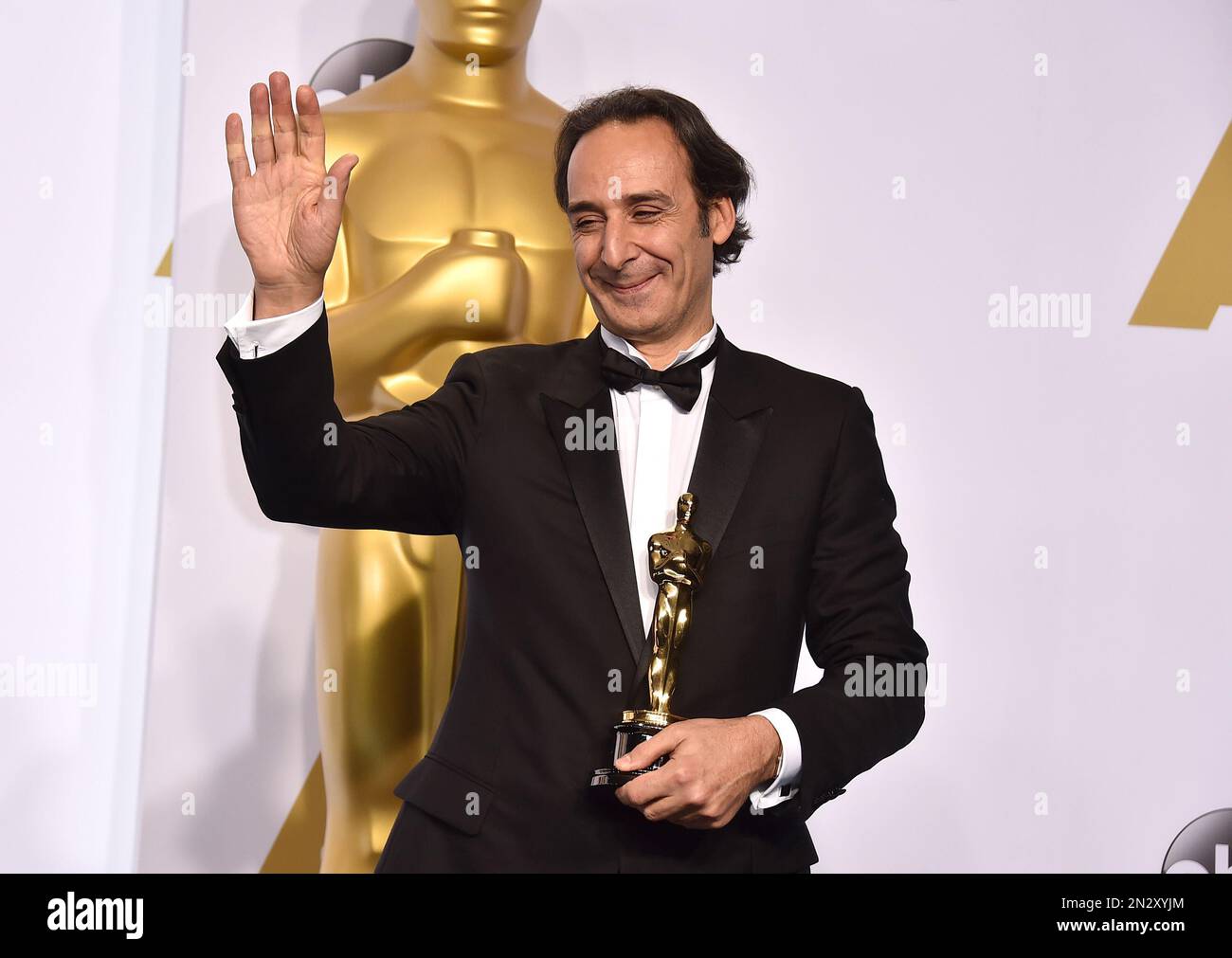 Alexandre Desplat poses in the press room with the award for best ...