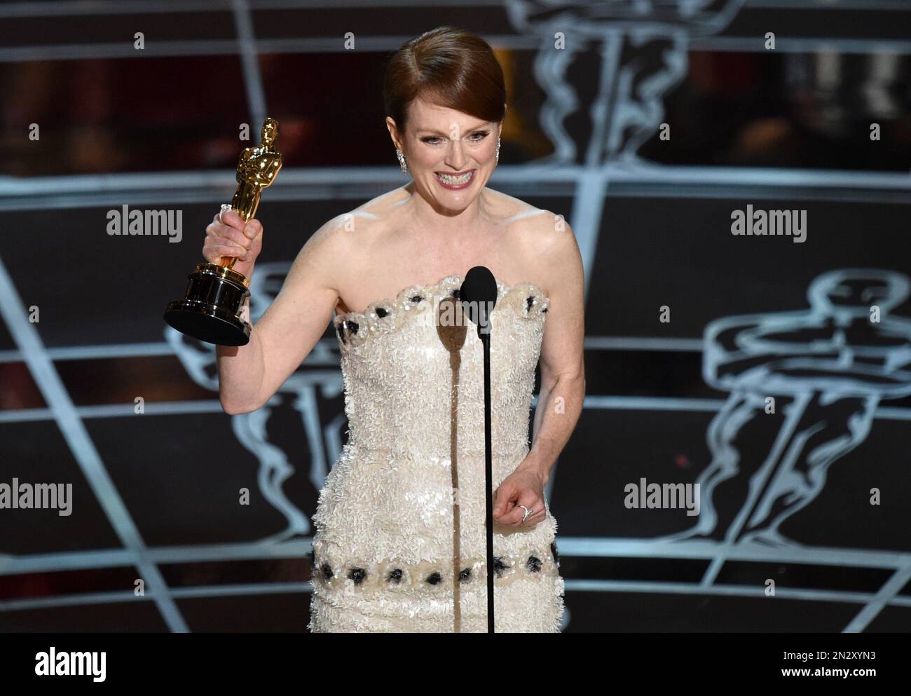 Julianne Moore accepts the award for best actress in a leading role for ...