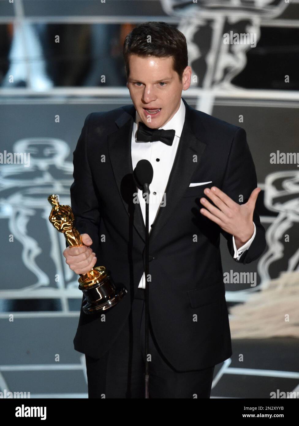 Graham Moore accepts the award for the best adapted screenplay for “The ...