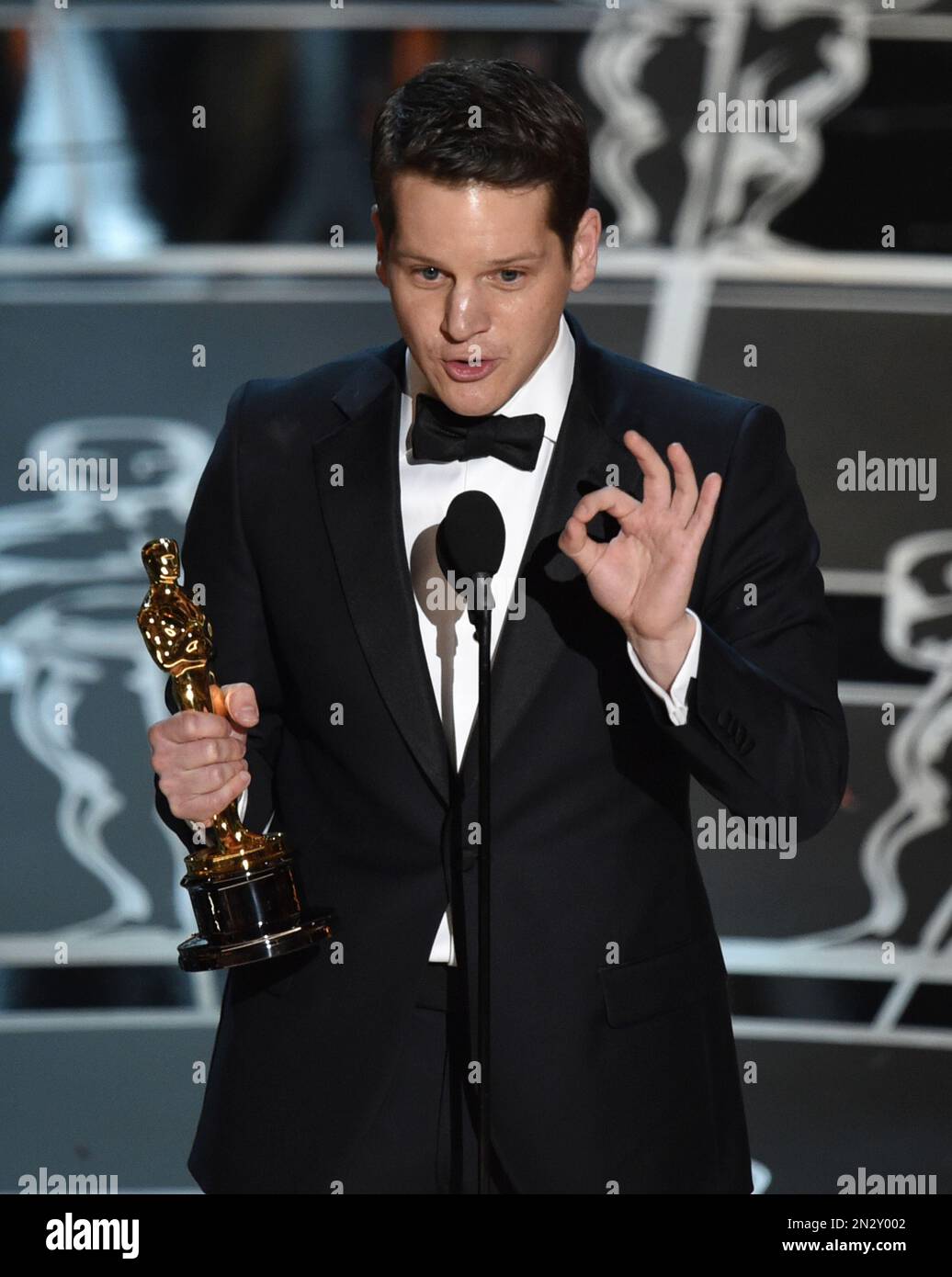 Graham Moore accepts the award for the best adapted screenplay for “The ...