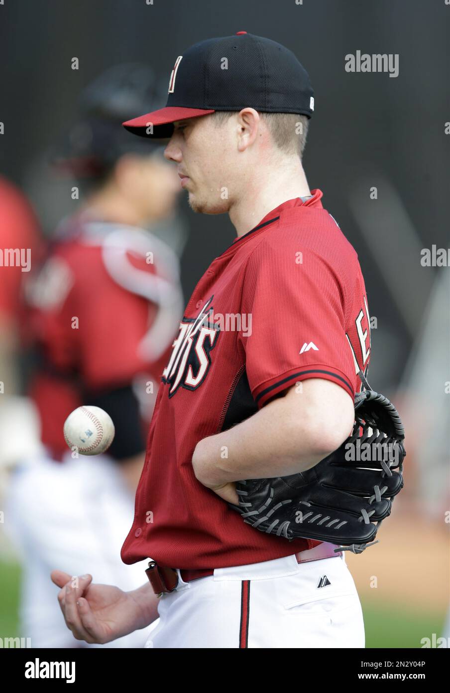Arizona Diamondbacks' Jeremy Hellickson (58) tosses the baseball after ...