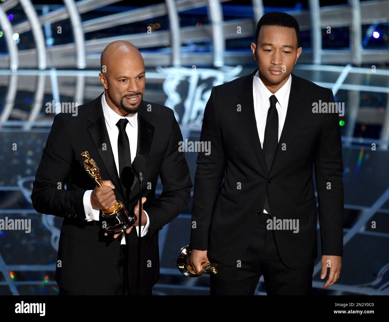 Common, left and John Legend accept the award for best original song in ...