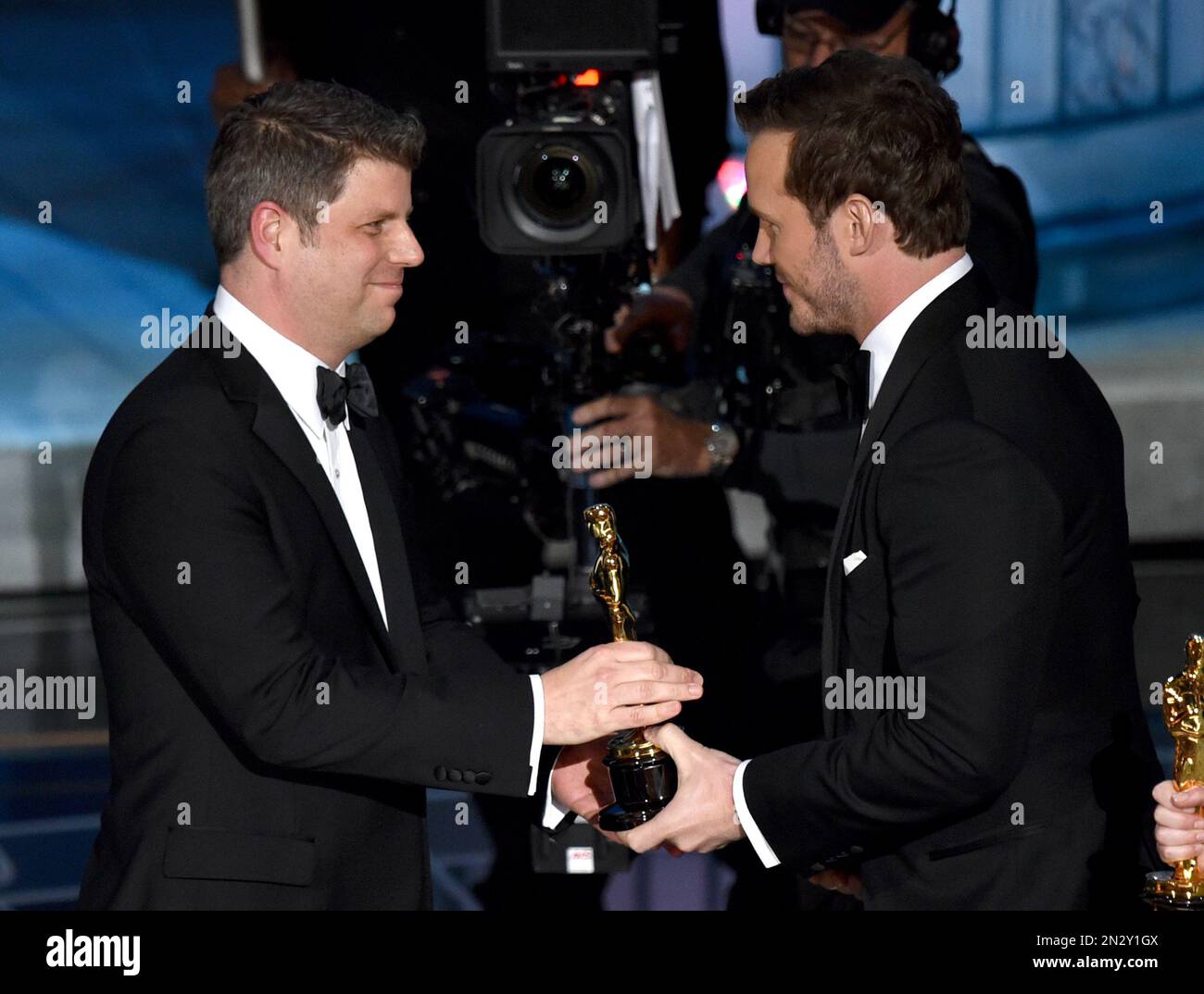 Chris Pratt, right, presents Adam Stockhausen with the award for best ...