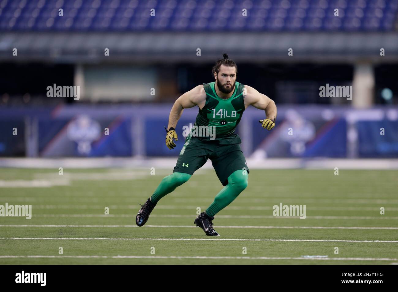 Kansas linebacker Ben Heeney runs a drill at the NFL football scouting ...