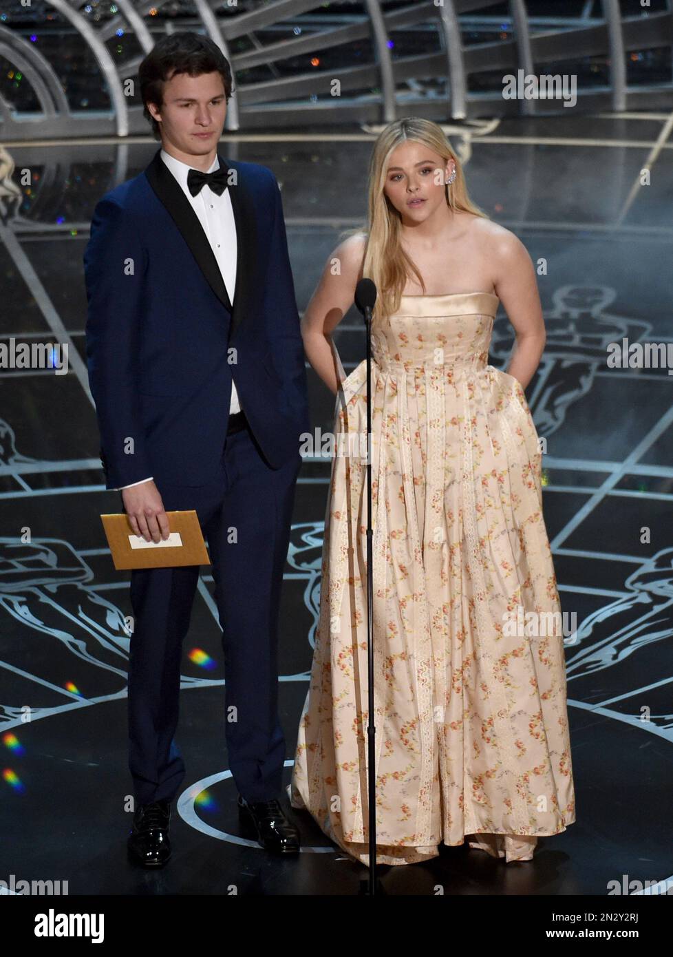 Ansel Elgort, left, and Chloe Moretz present the award for achievement ...