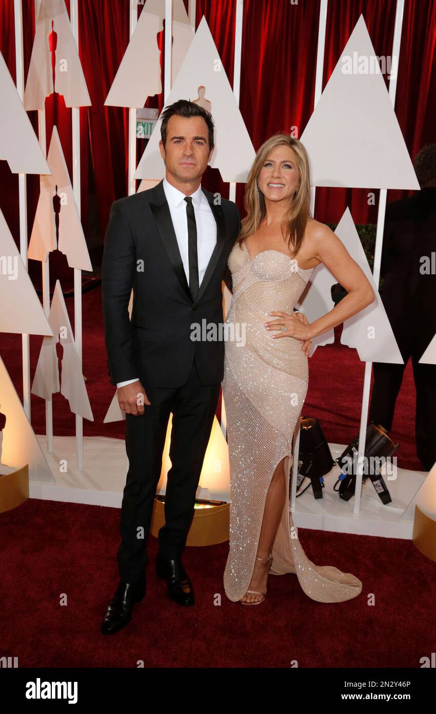 Justin Theroux, left, and Jennifer Aniston arrive at the Oscars on ...