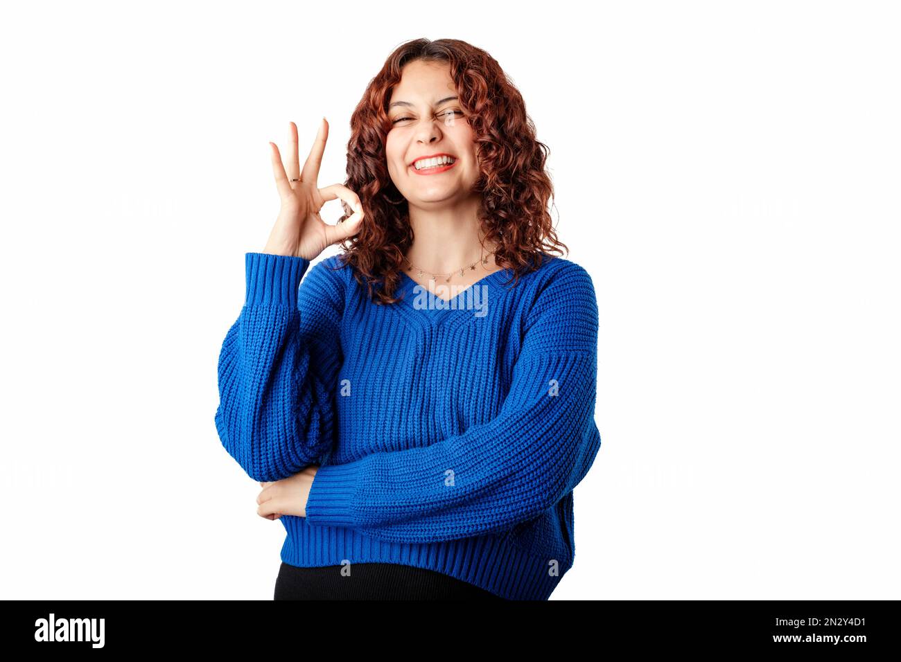 Young woman smiling confident wearing blue knitted sweater standing ...