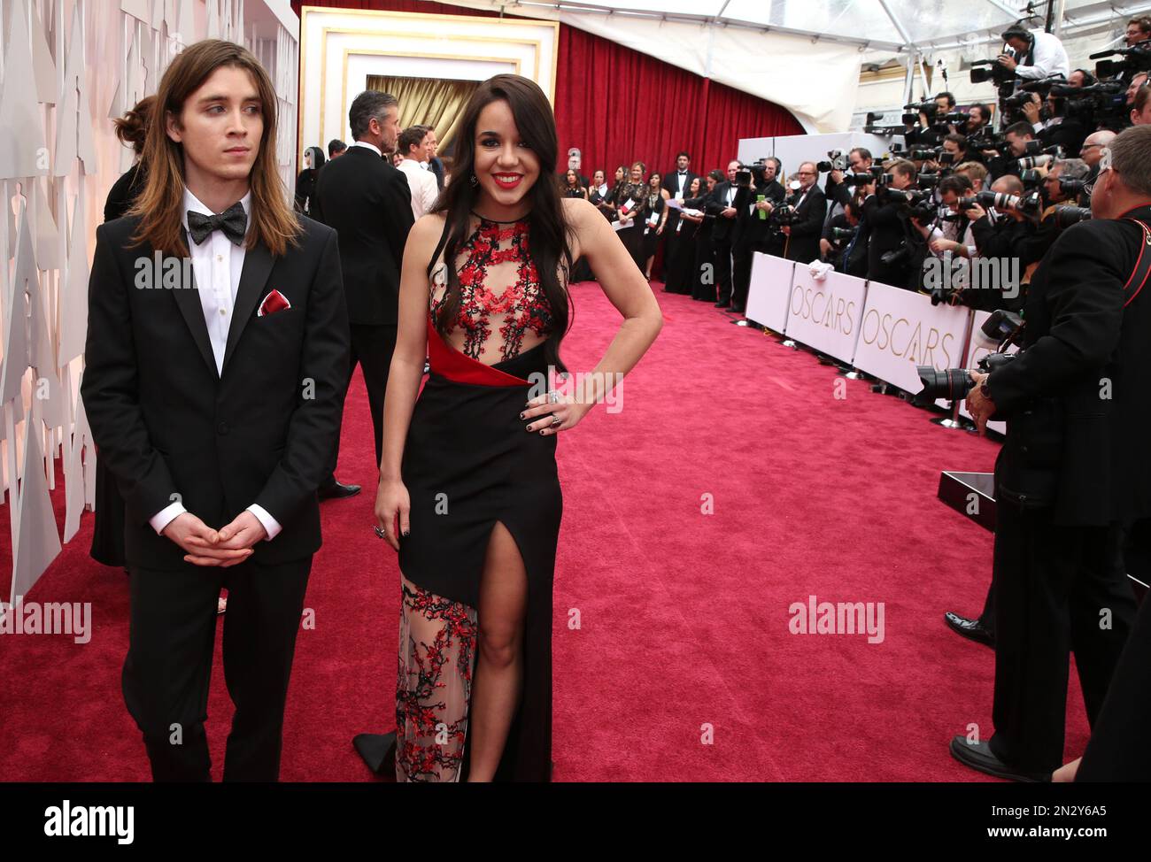 Justin Jacobs, left, and Lorelei Linklater arrive at the Oscars on Sunday, Feb. 22, 2015, at the ...