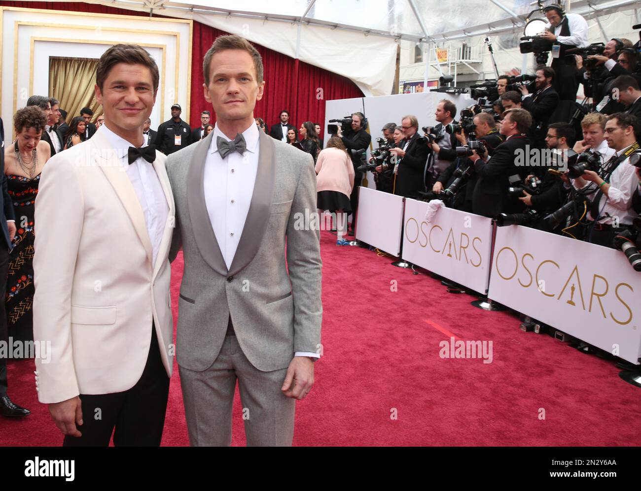 David Burtka, left, and Neil Patrick Harris arrive at the Oscars on ...