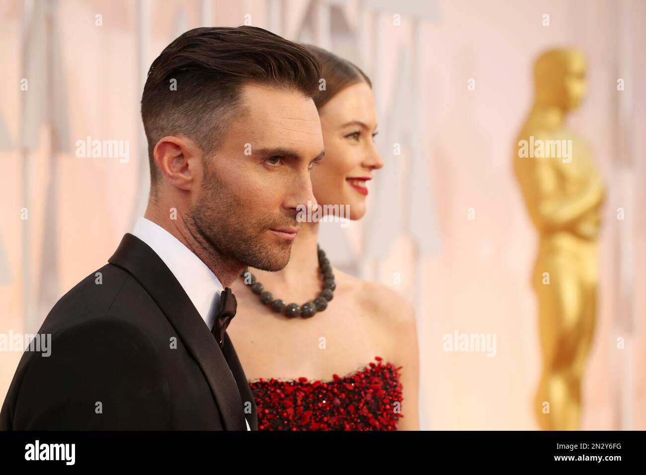 Adam Levine, left, and Behati Prinsloo arrive at the Oscars on Sunday ...