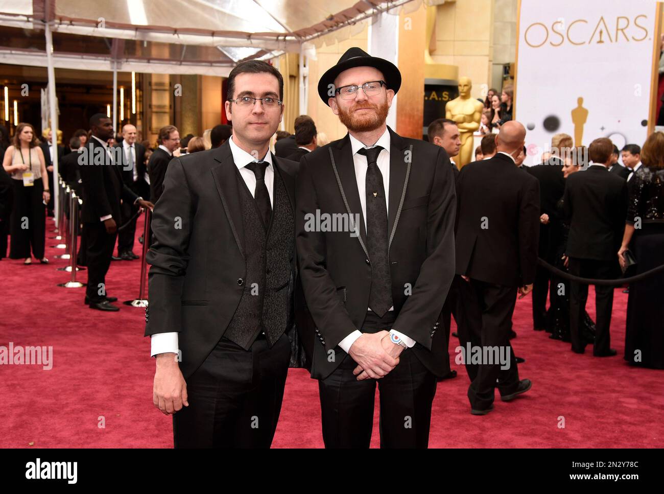 Tomm Moore, left, and Paul Young arrive at the Oscars on Sunday, Feb ...