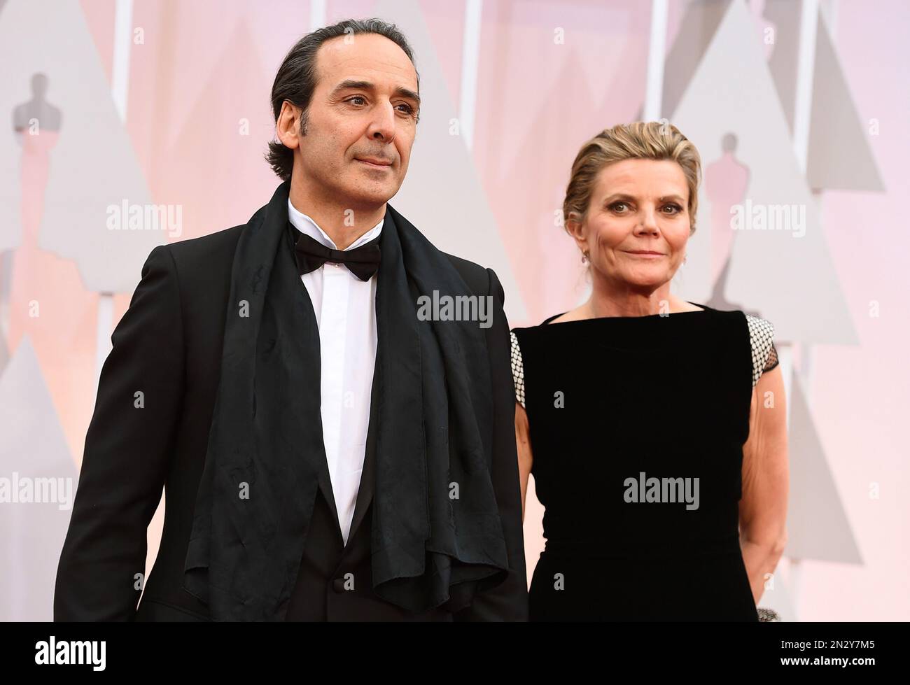 Alexandre Desplat, left, and Dominique LeMonnier arrive at the Oscars ...