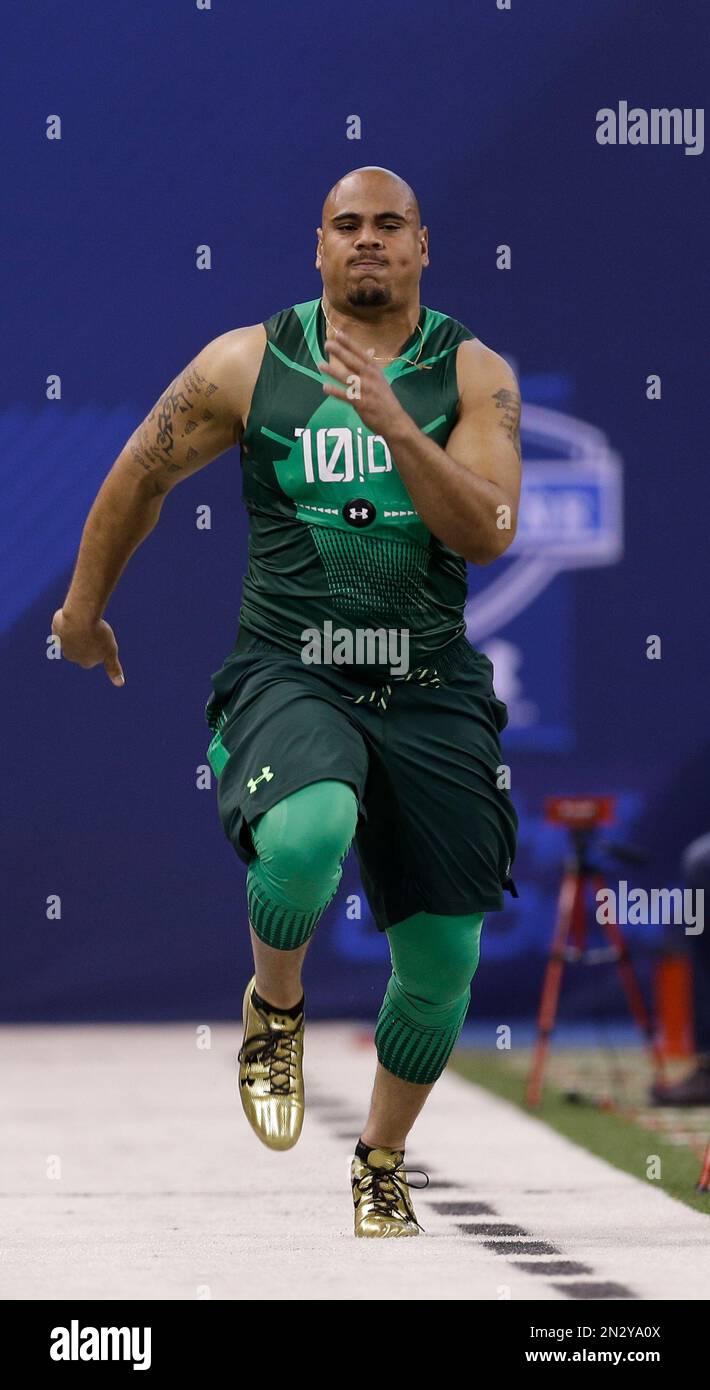 Washington State defensive lineman Xavier Cooper runs the 40-yard dash ...