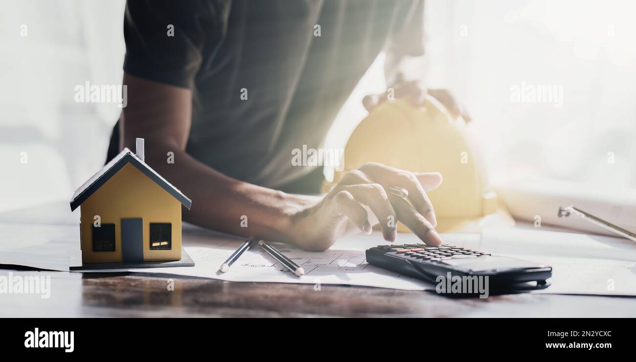 Architecture or Civil engineer analyze with construction blueprint ...