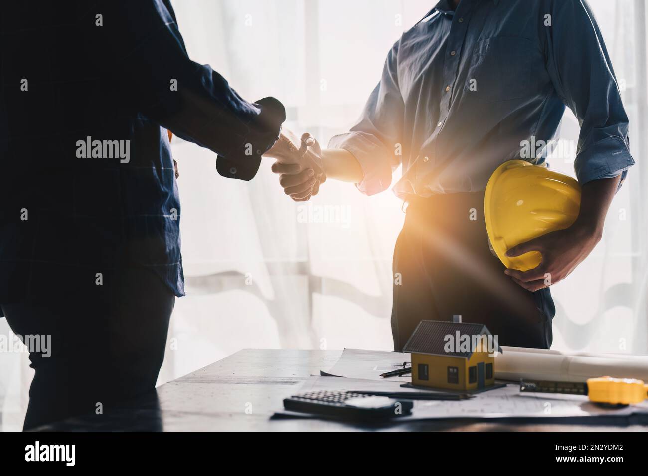 Architecture or Civil engineer analyze handshake making modern ...