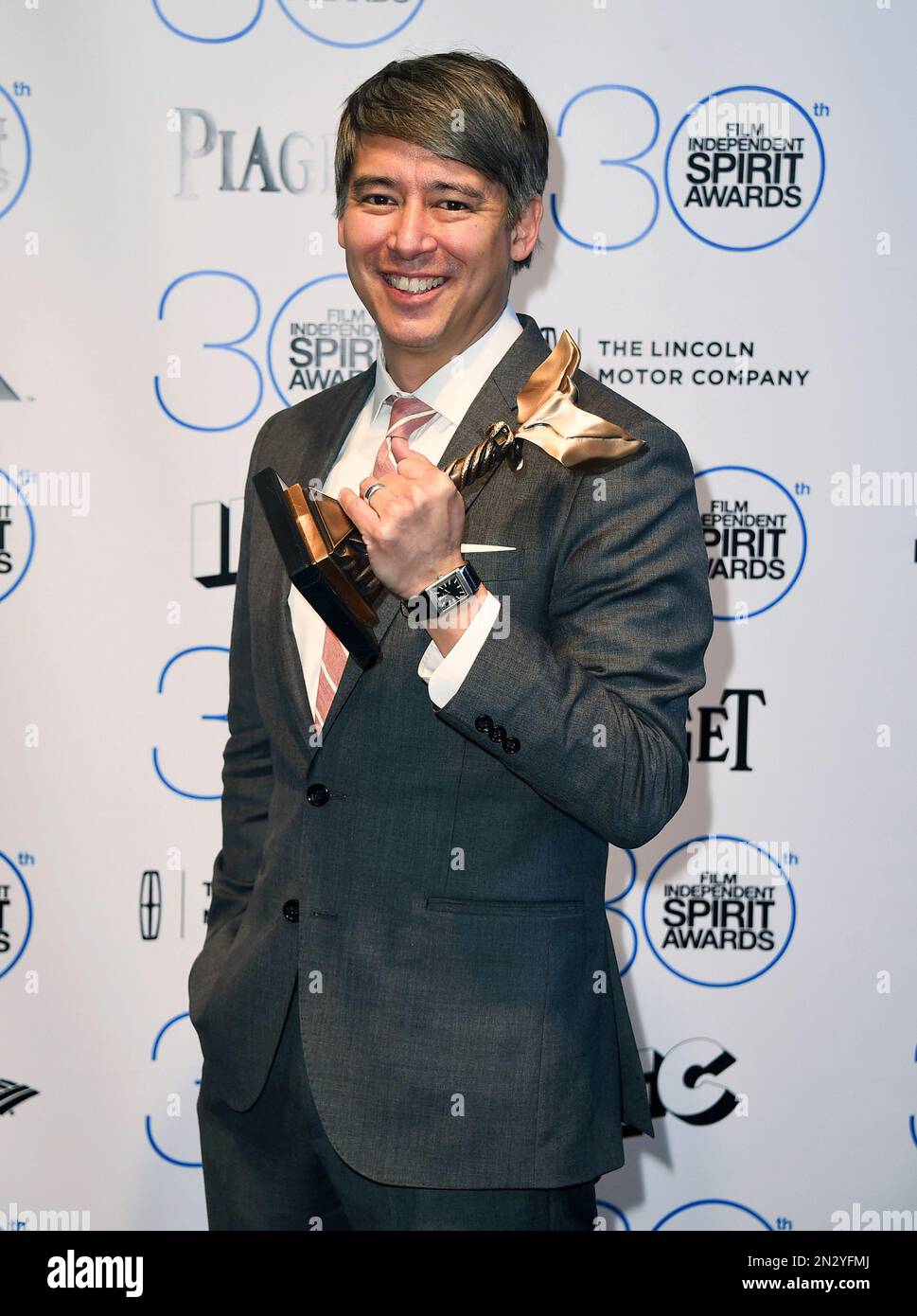 Tom Cross, winner of the best editing award for "Whiplash", poses in ...