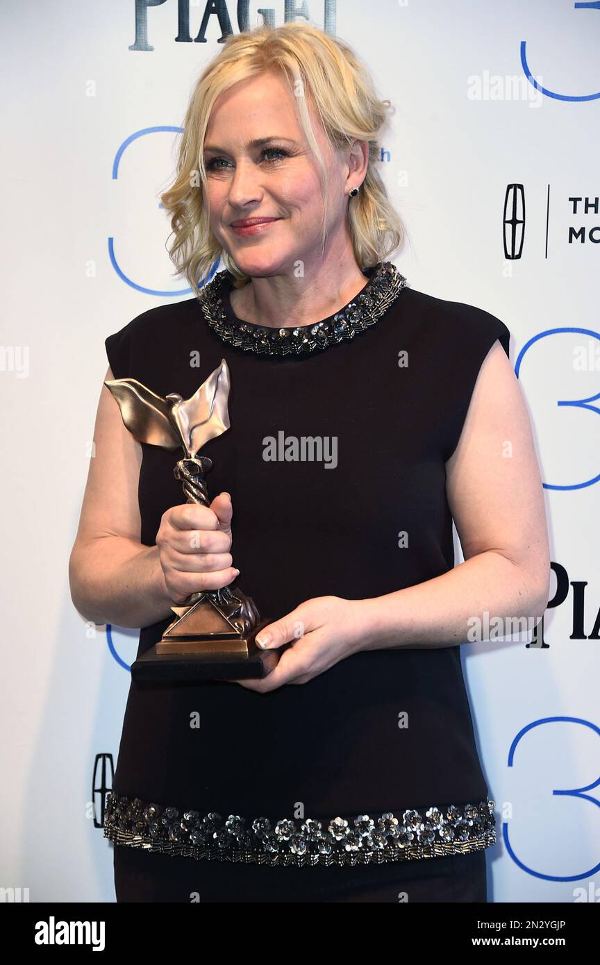 Patricia Arquette poses in the press room with the award for best ...