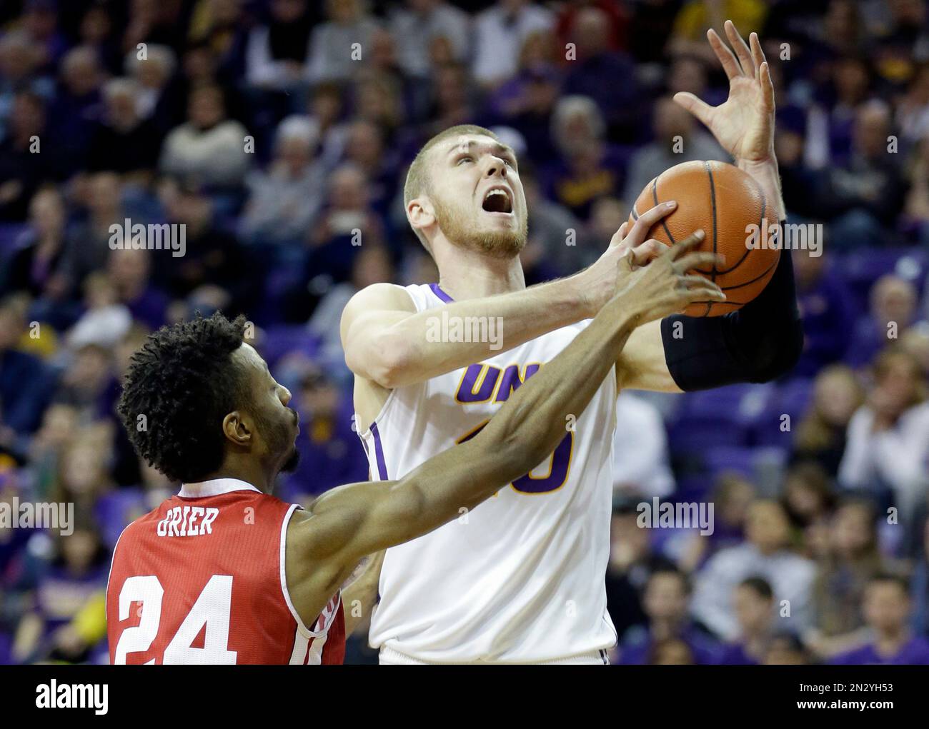 Northern Iowa forward Seth Tuttle shoots over Bradley guard Omari Grier ...