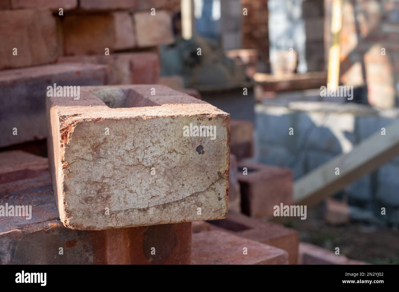 Building site: trowel, bricks and mortar for brickwork, part of a ...