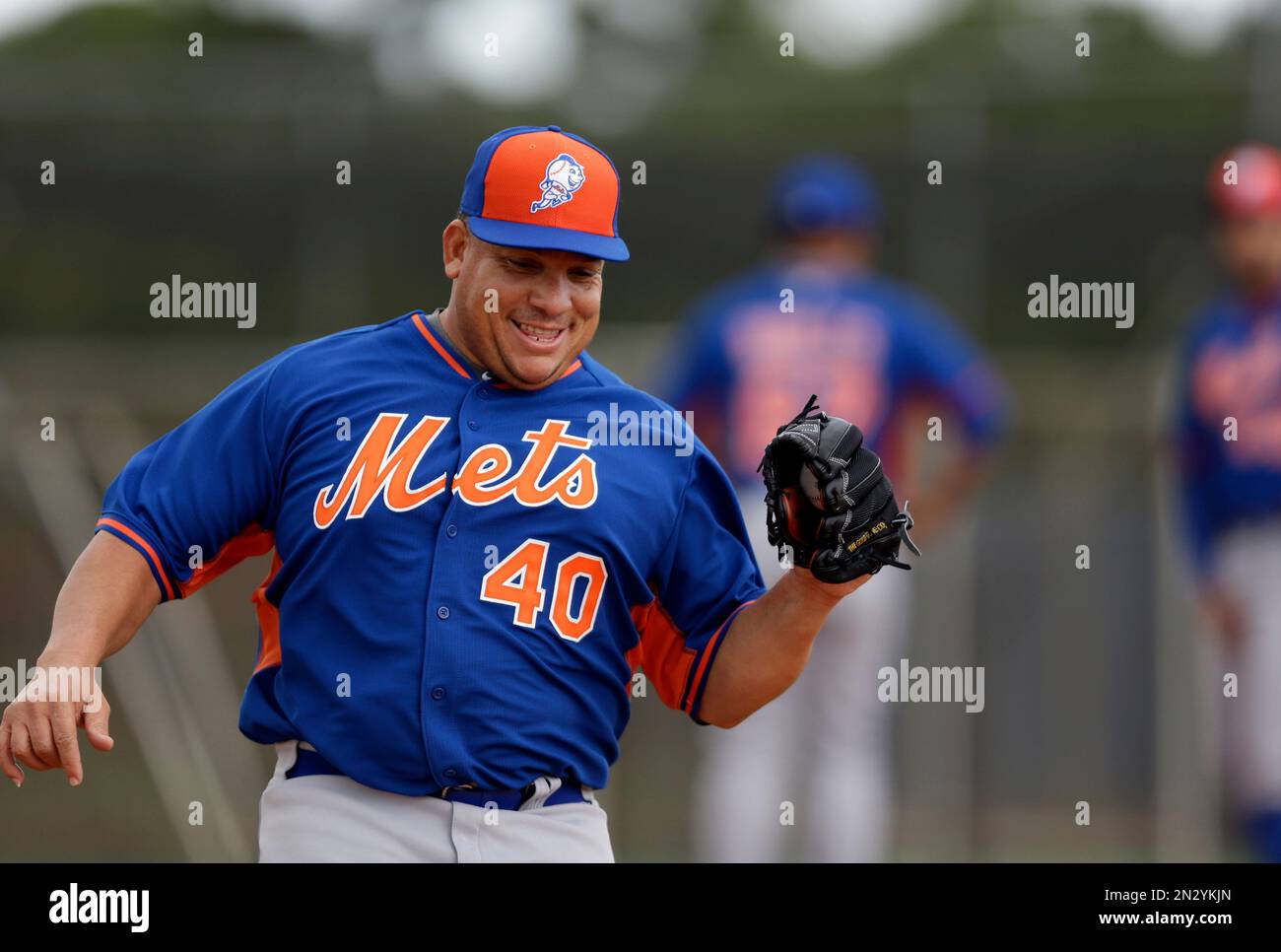 New York Mets pitcher Bartolo Colon takes part in a drill during spring ...