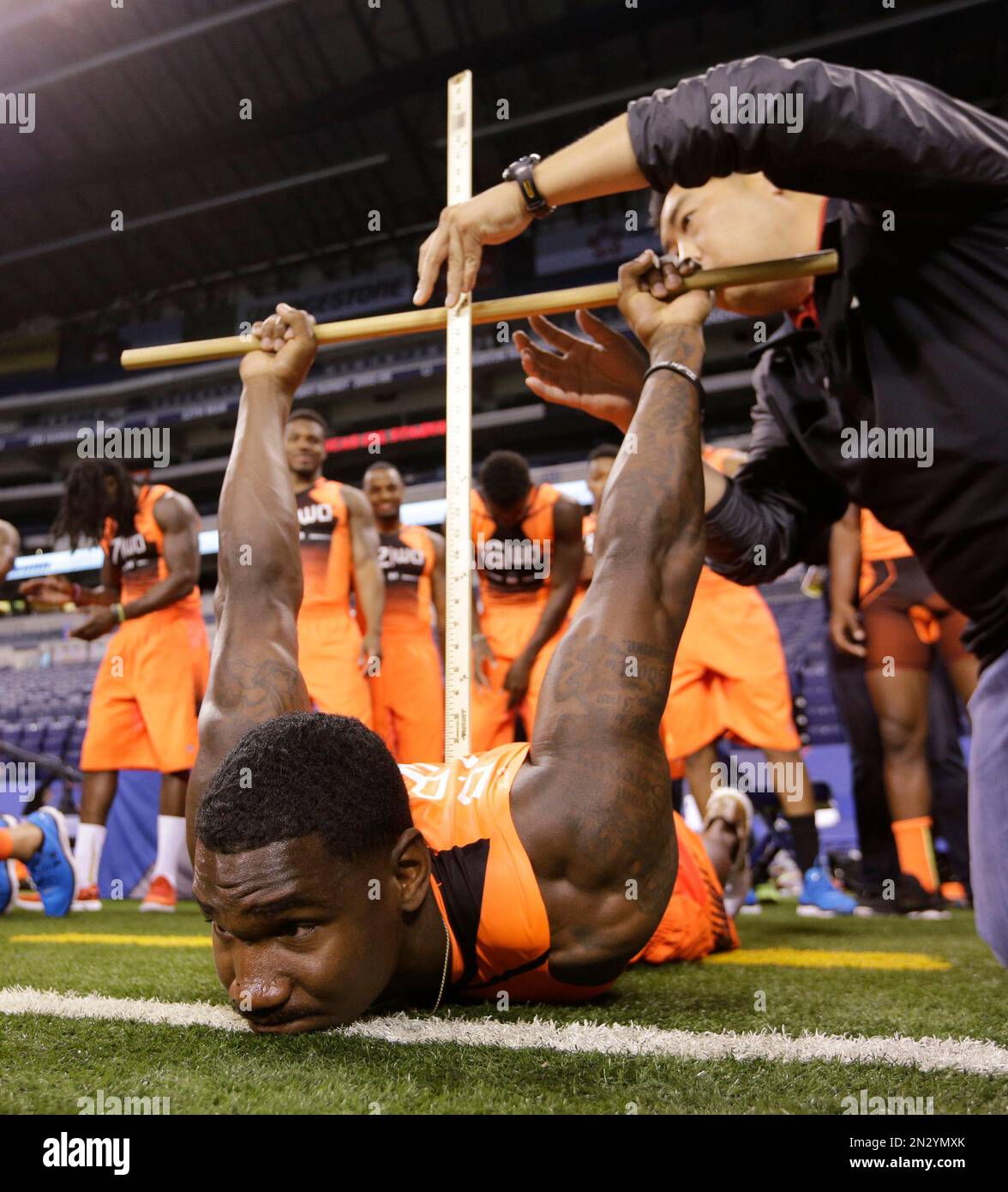 UNLV wide receiver Devante Davis, left, is measured for flexibility by ...