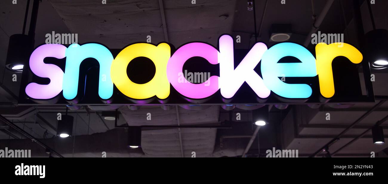 Illuminated sign saying: 'Snacker' in a retail outlet Stock Photo - Alamy