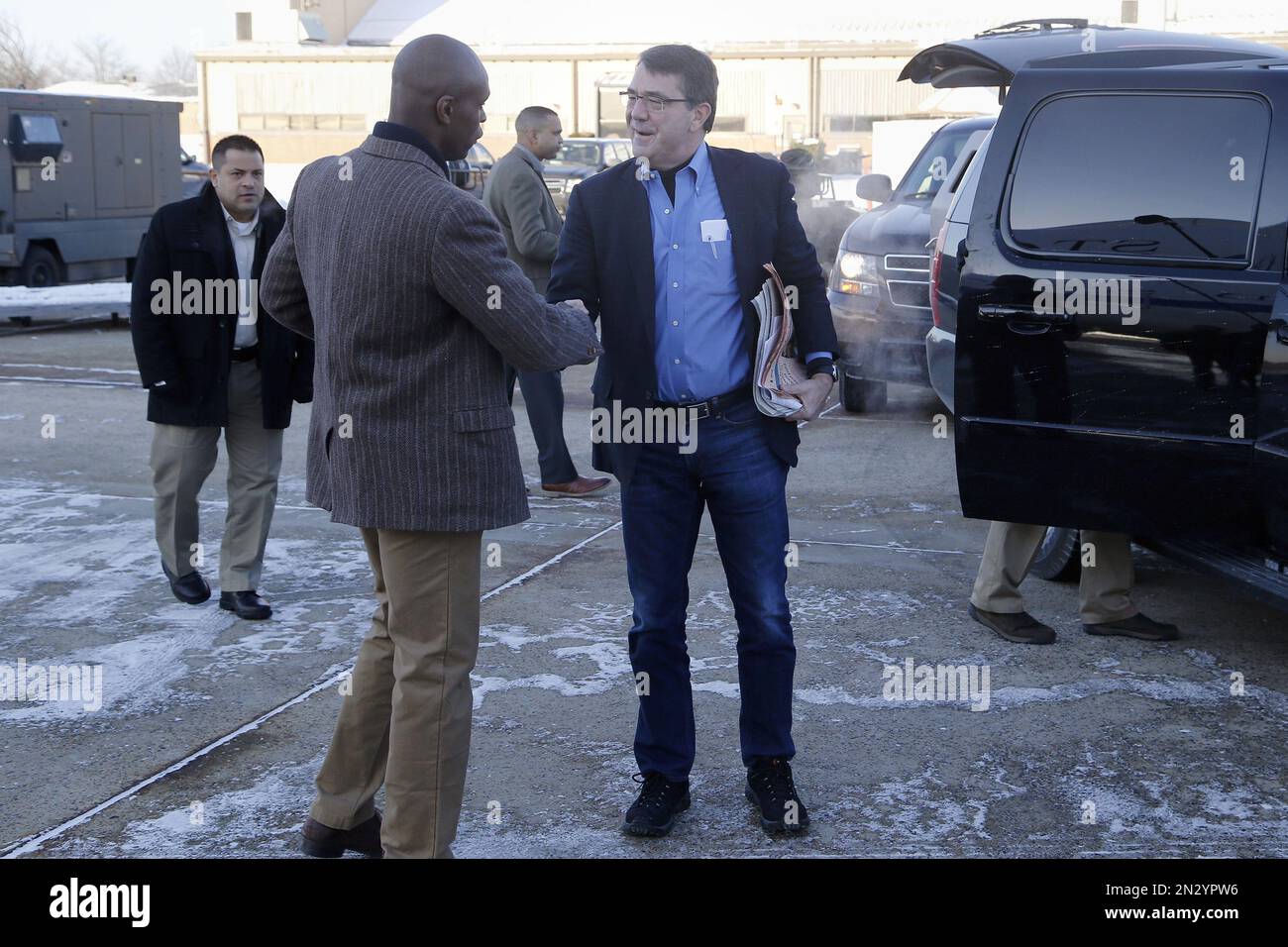 U.S. Secretary of Defense Ashton Carter, center, is greeted by Senior ...