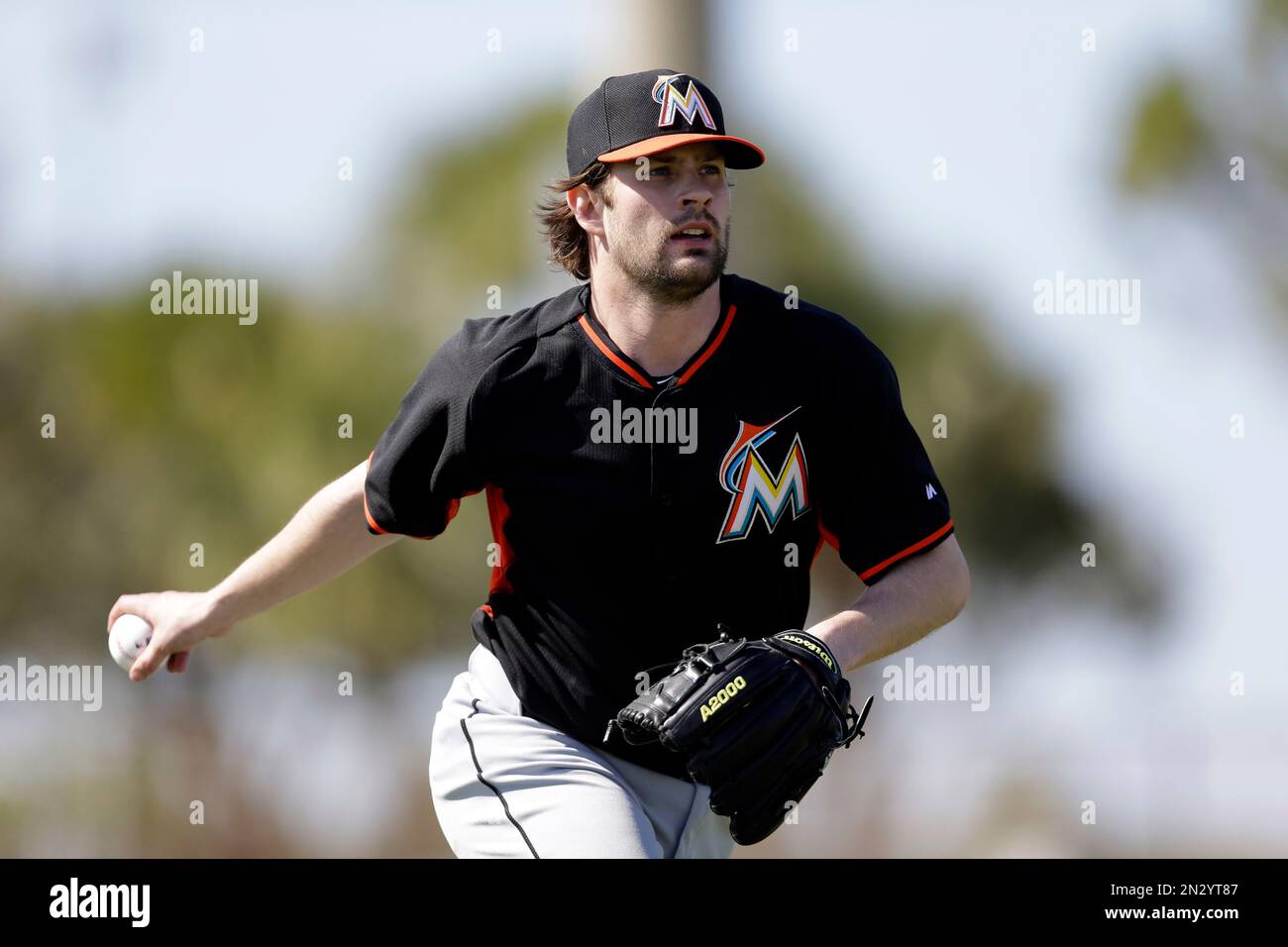 Miami Marlins pitcher Aaron Crow tosses to first as part of a fielding ...