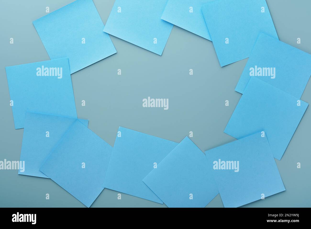 Blue paper stickers on black background. Sticky notes blank with copy ...