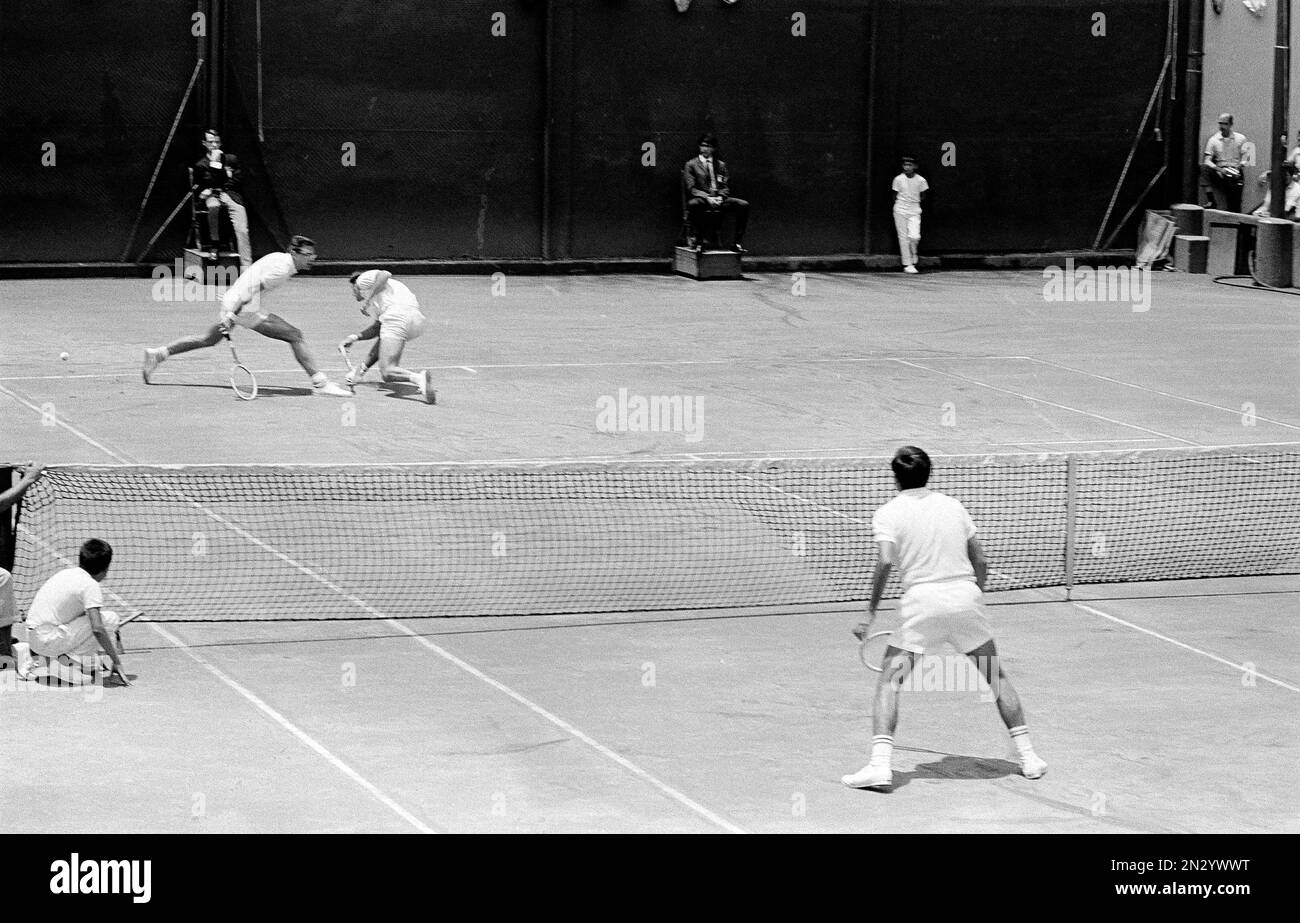 Marty Riessen, the 23-year-old Beachwood, Ohio youngster, right, goes ...