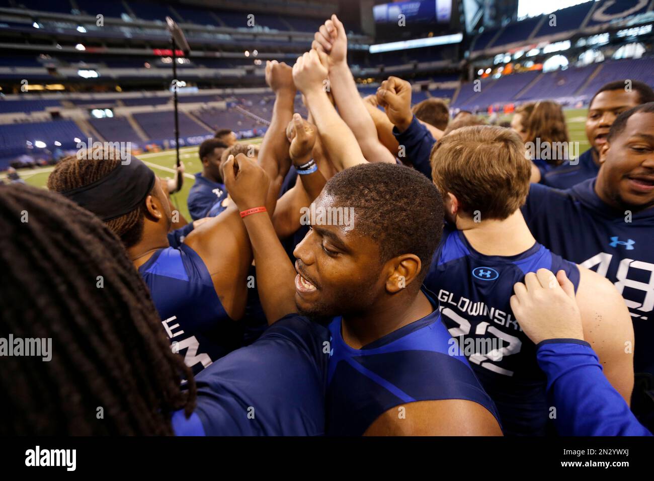 Duke offensive lineman Laken Tomlinson, center, huddles with athletes ...
