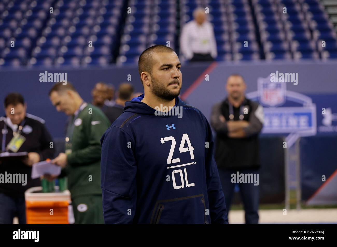 Oregon offensive lineman Hroniss Grasu watches players warm up at the ...