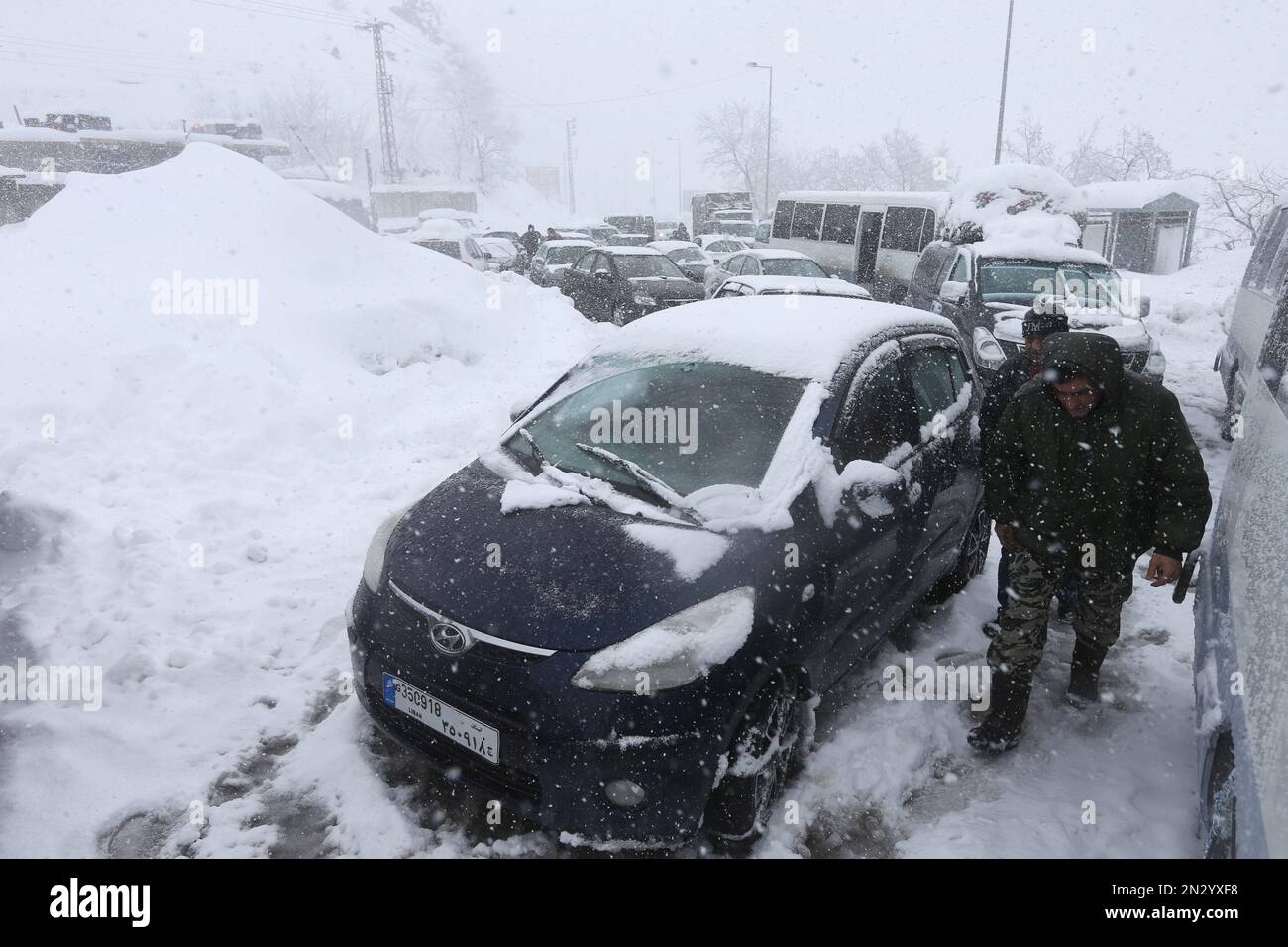 Lebanese and Syrian cars wait in traffic after the heavy snow storm ...
