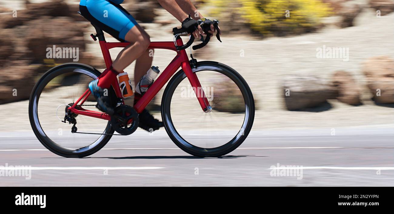Road bike cyclist man cycling, athlete on a race cycle. Panning ...