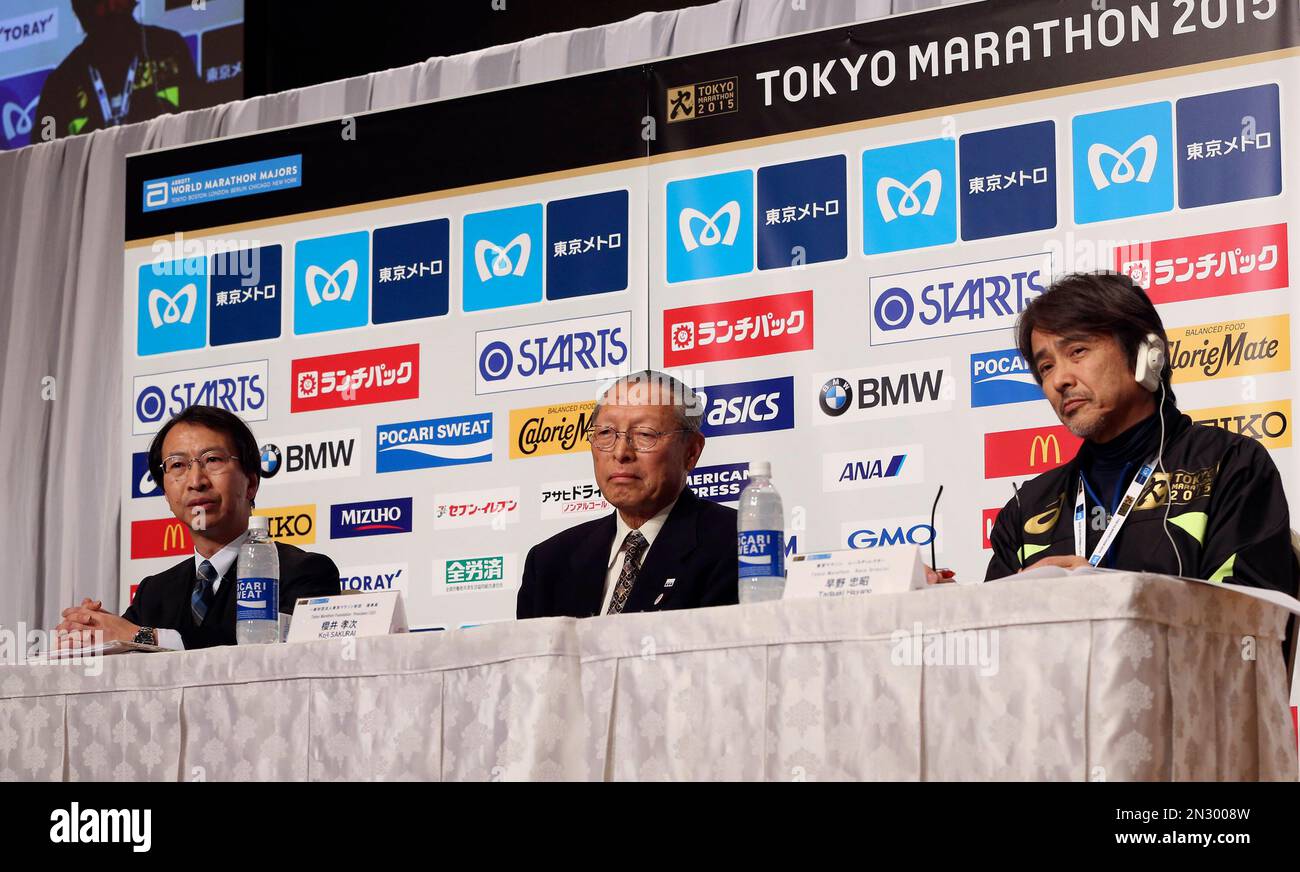 Masayuki Tezuka, left, Tokyo Marathon chief operating officer, Koji ...