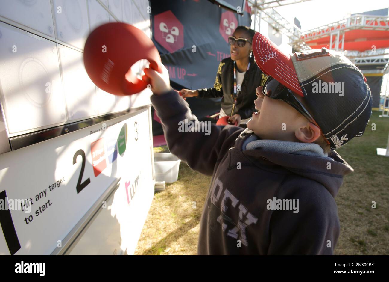 Adam Rummings, 5, of Bradenton, Fla., tests his reflexes by hitting a ...