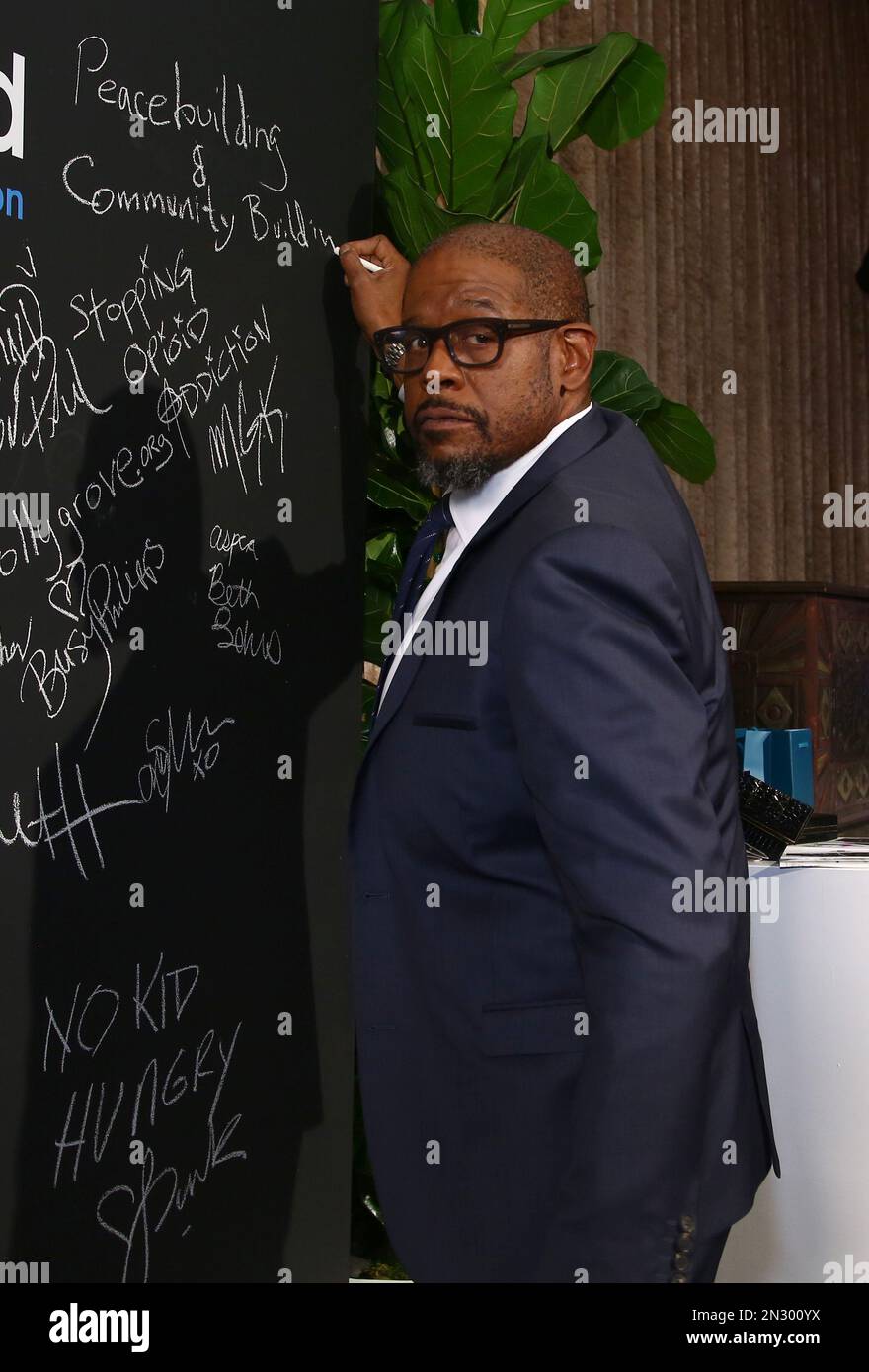 EXCLUSIVE -Forest Whitaker signs the chalk wall during unite4:good and ...