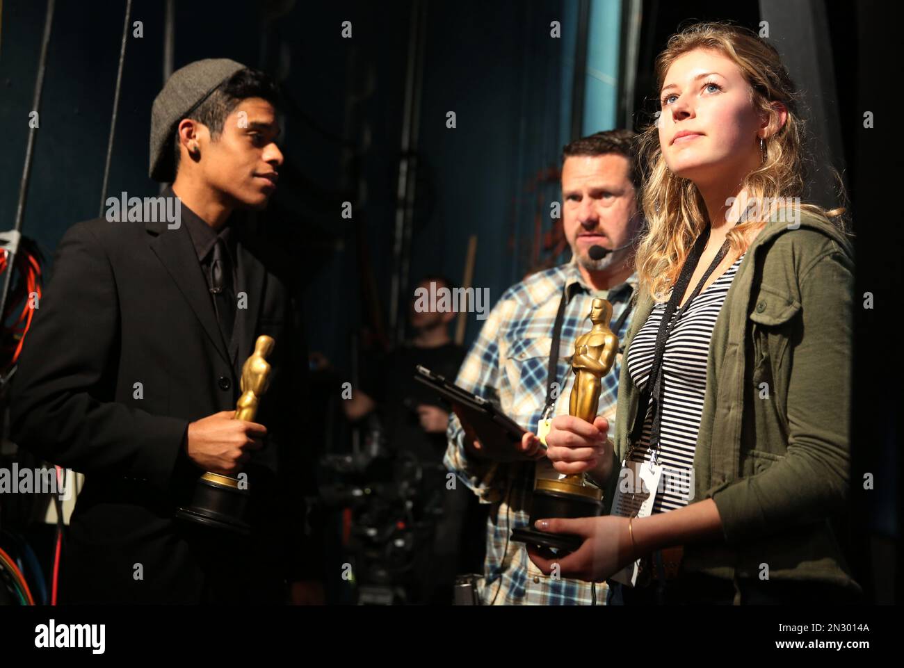 In this Wednesday, Feb. 18, 2015 photo, student trophy presenters Kelly ...