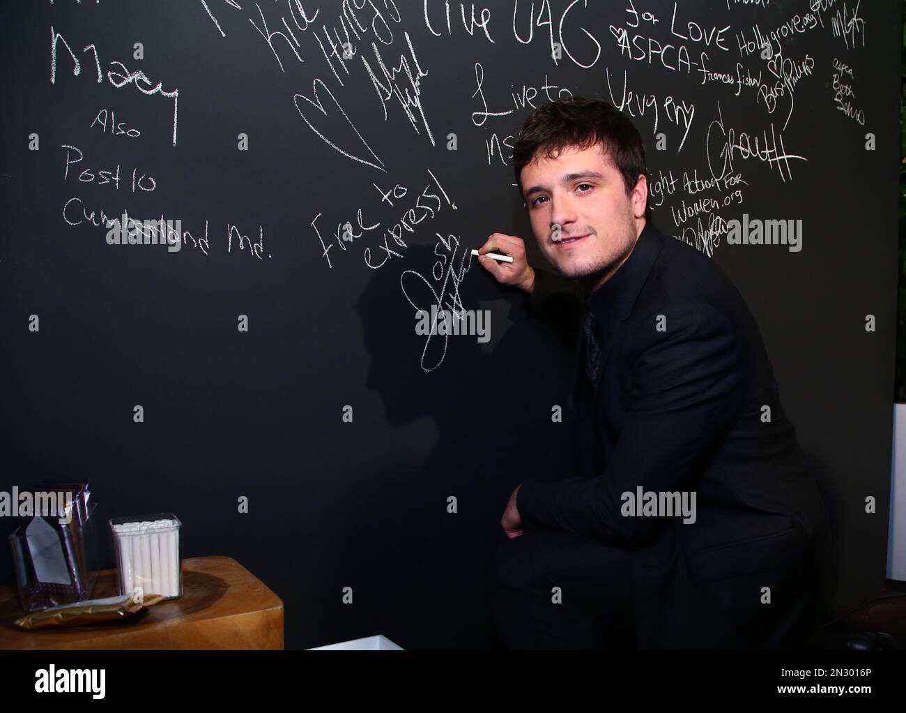 EXCLUSIVE - Josh Hutcherson signs the chalk wall during unite4:good and ...