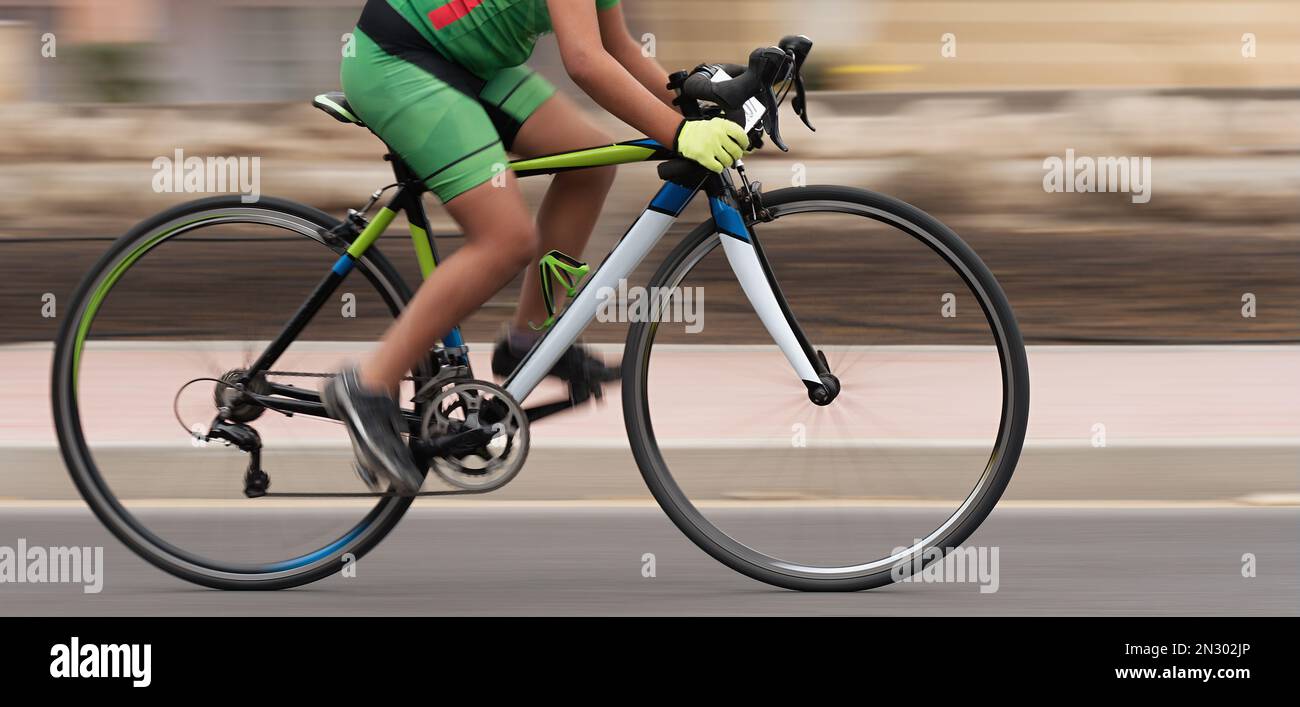 Cycling rider competing in the youth class, motion blur of a bike race ...
