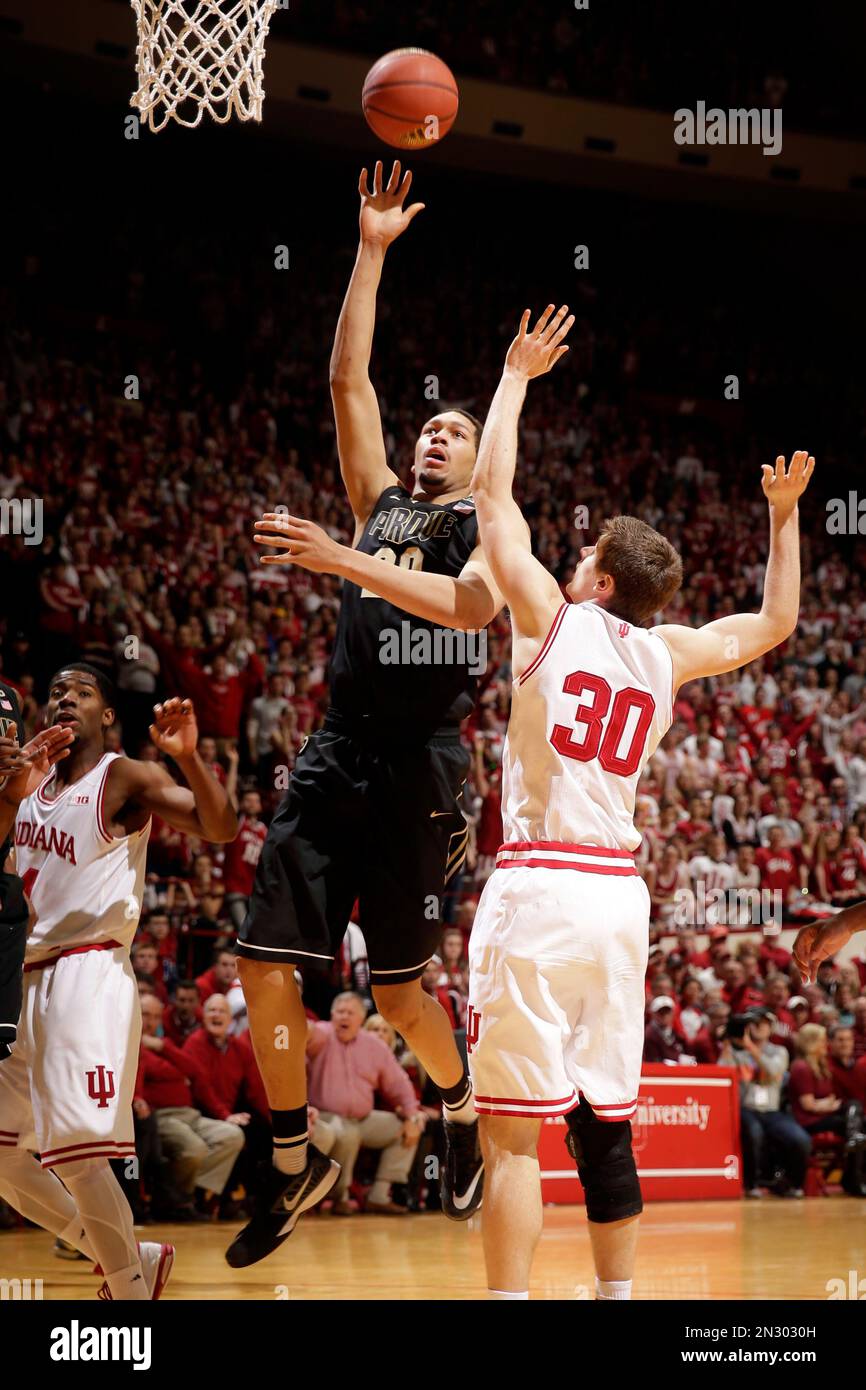 Purdue center A.J. Hammons shoots next to Indiana forward Collin ...
