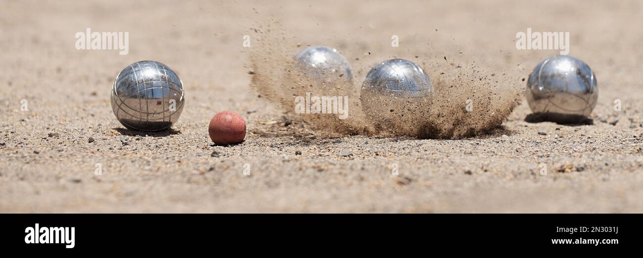 Petanque ball boules bowls on a dust floor, photo in impact. Balls and ...