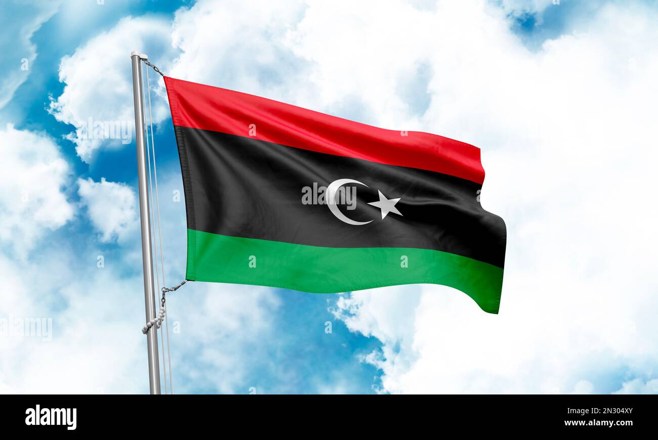 Libya flag waving on sky background. 3D Rendering Stock Photo - Alamy