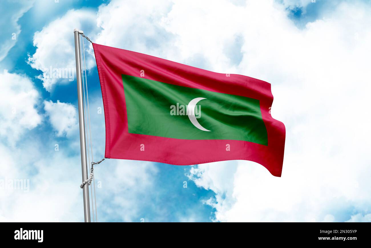 Maldives flag waving on sky background. 3D Rendering Stock Photo - Alamy