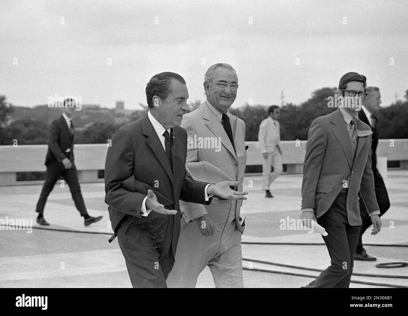 President Nixon walks with former President Lyndon Johnson during the ...